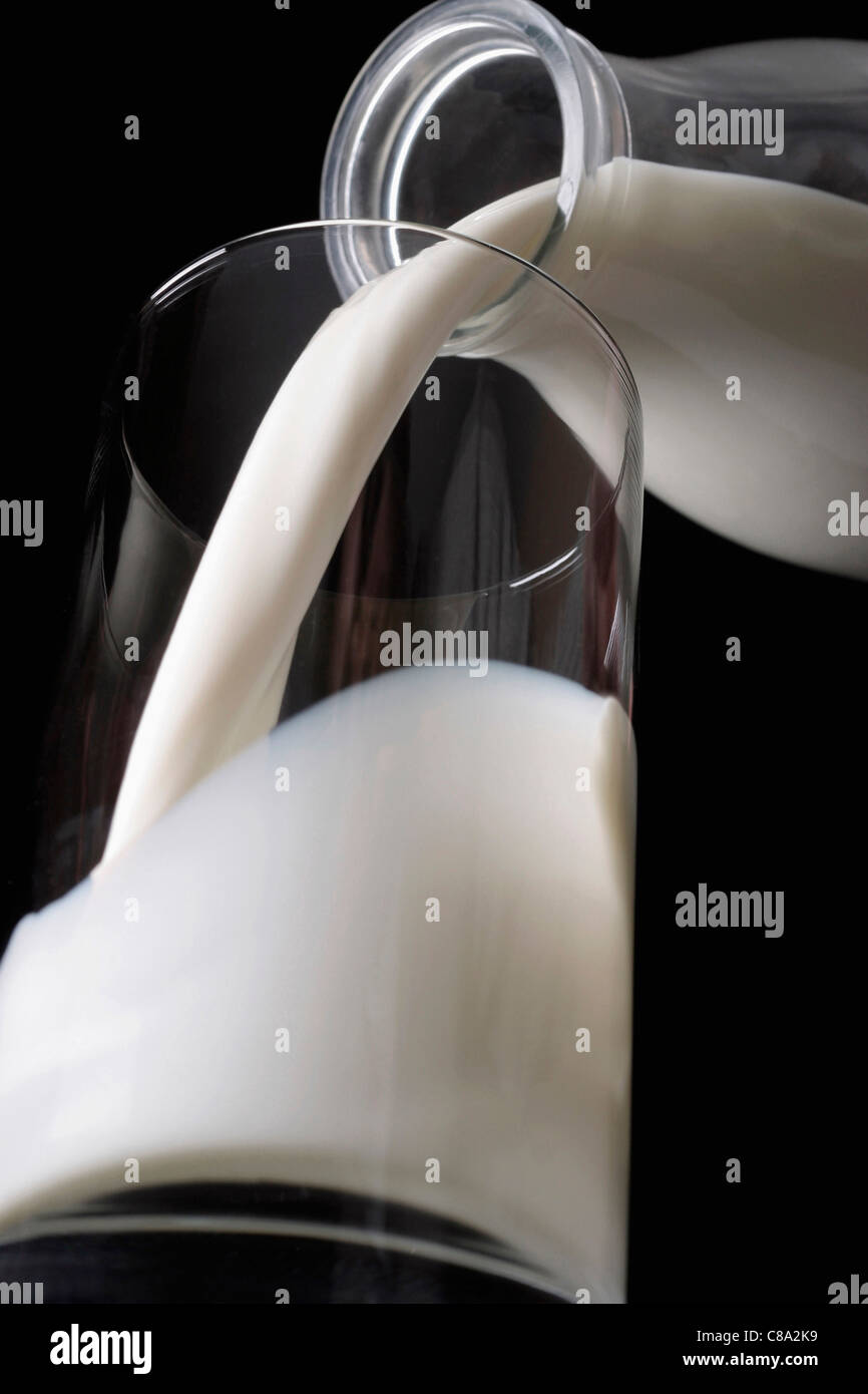 Black child pouring milk hi-res stock photography and images - Alamy