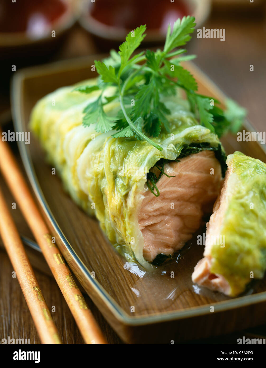 Steam-cooked salmon wrapped in chinese cabbage Stock Photo - Alamy