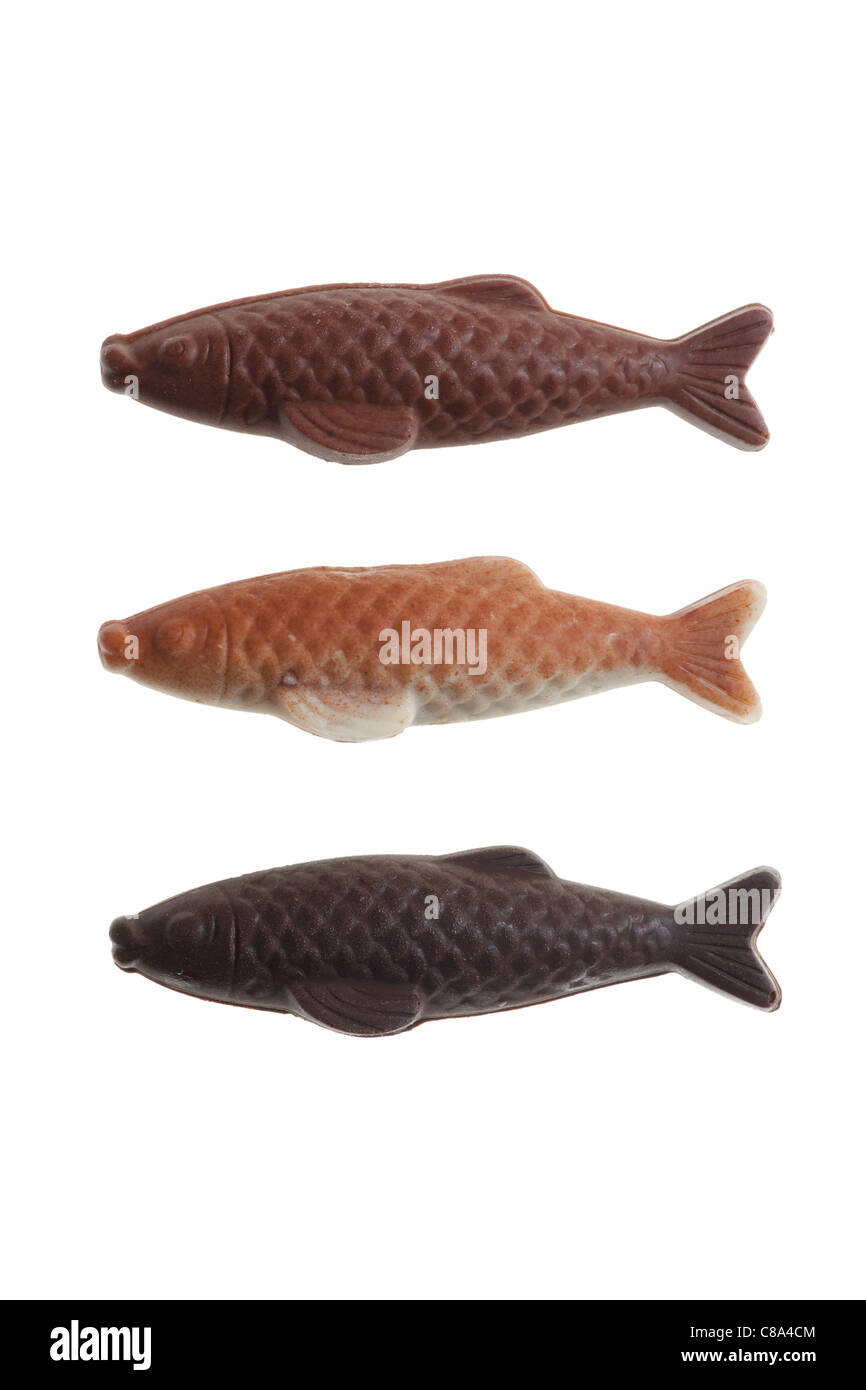 Three chocolate fishes made of dark chocolate, white chocolate and milk ...