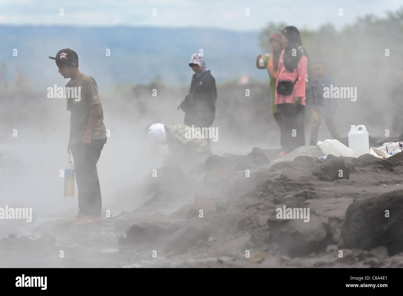 Local tourists at the Gendol river which flows through the remains of a ...