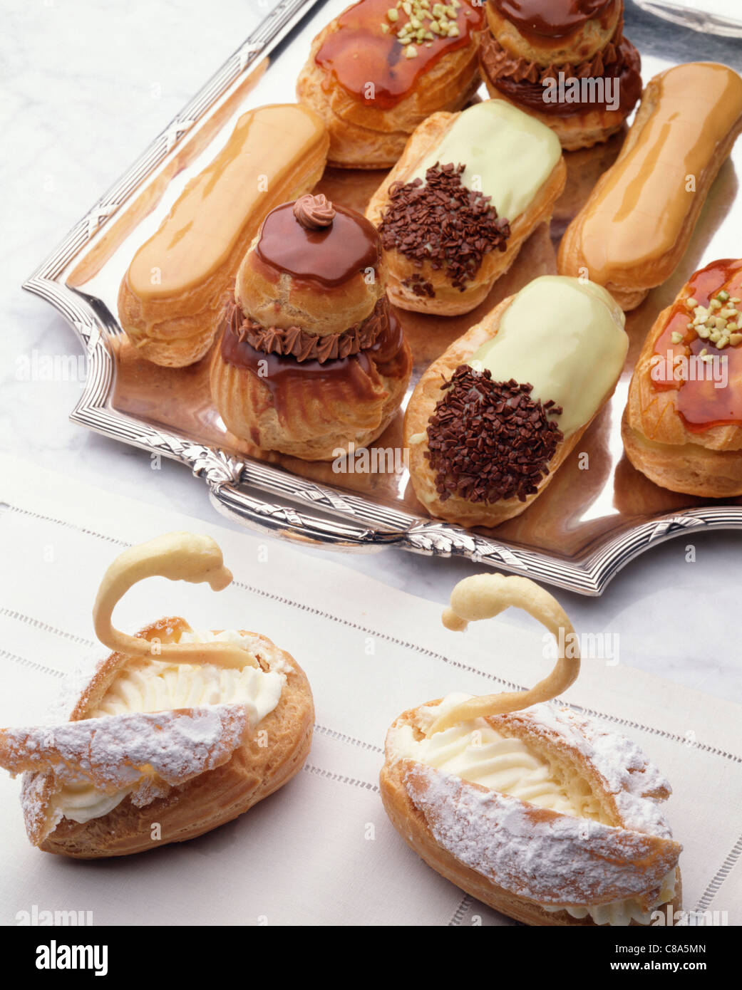 Individual cream cakes Stock Photo - Alamy