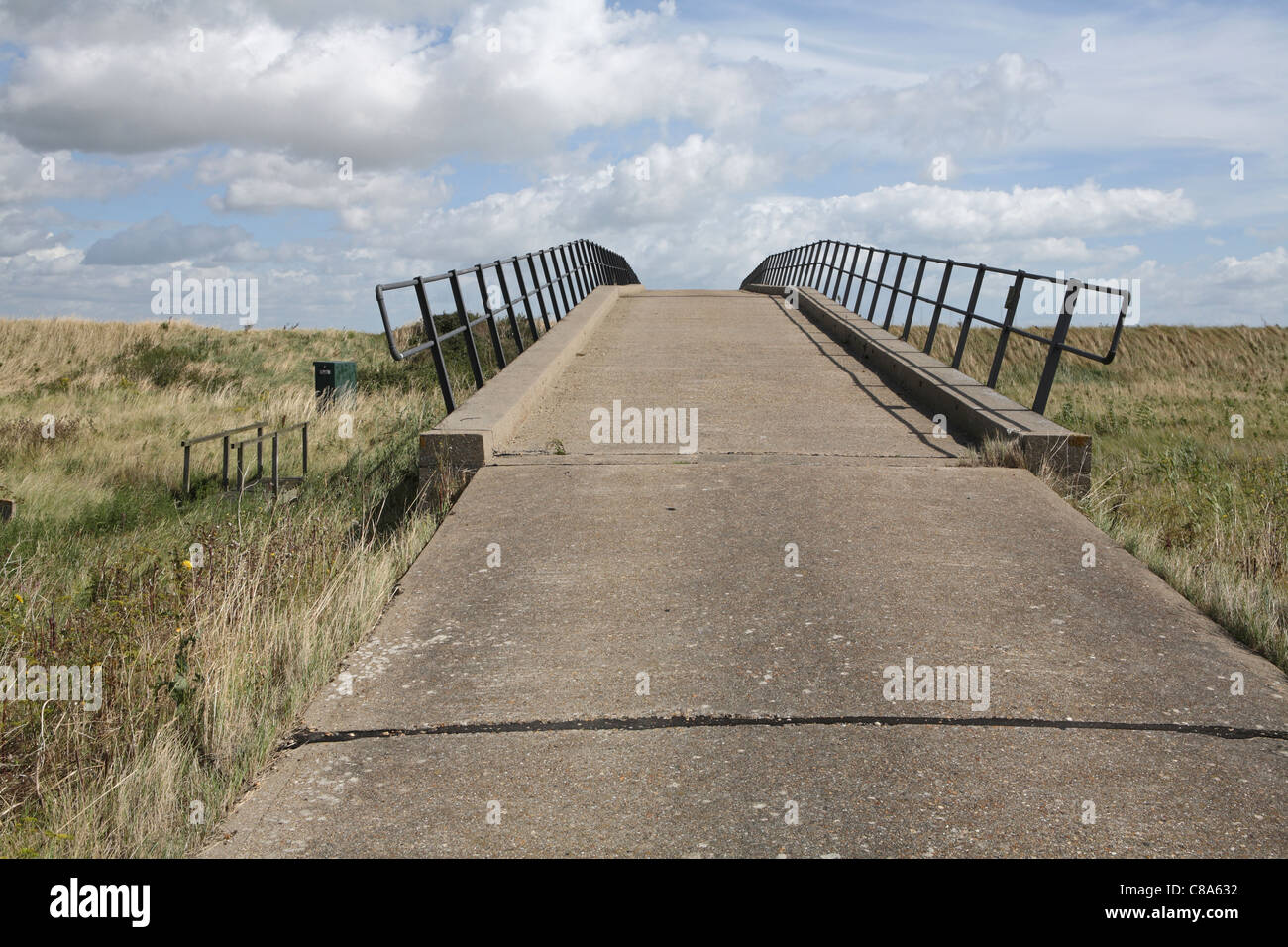 Concrete Road and bridge, under blue sky, Orford Ness National Nature ...