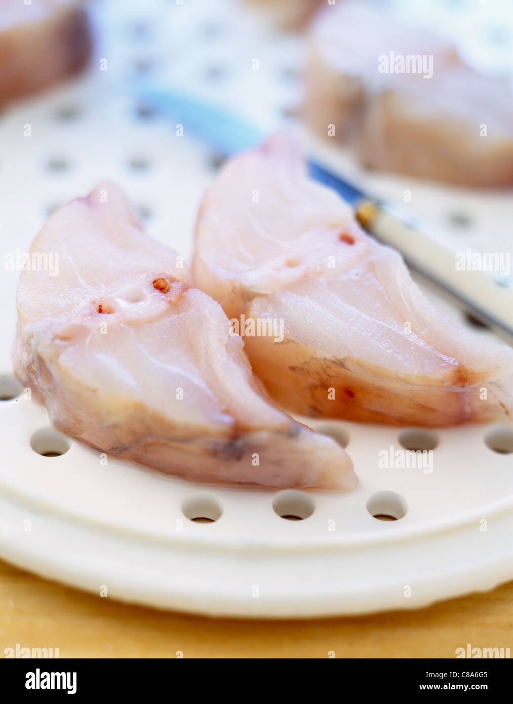 Raw monkfish steaks Stock Photo - Alamy
