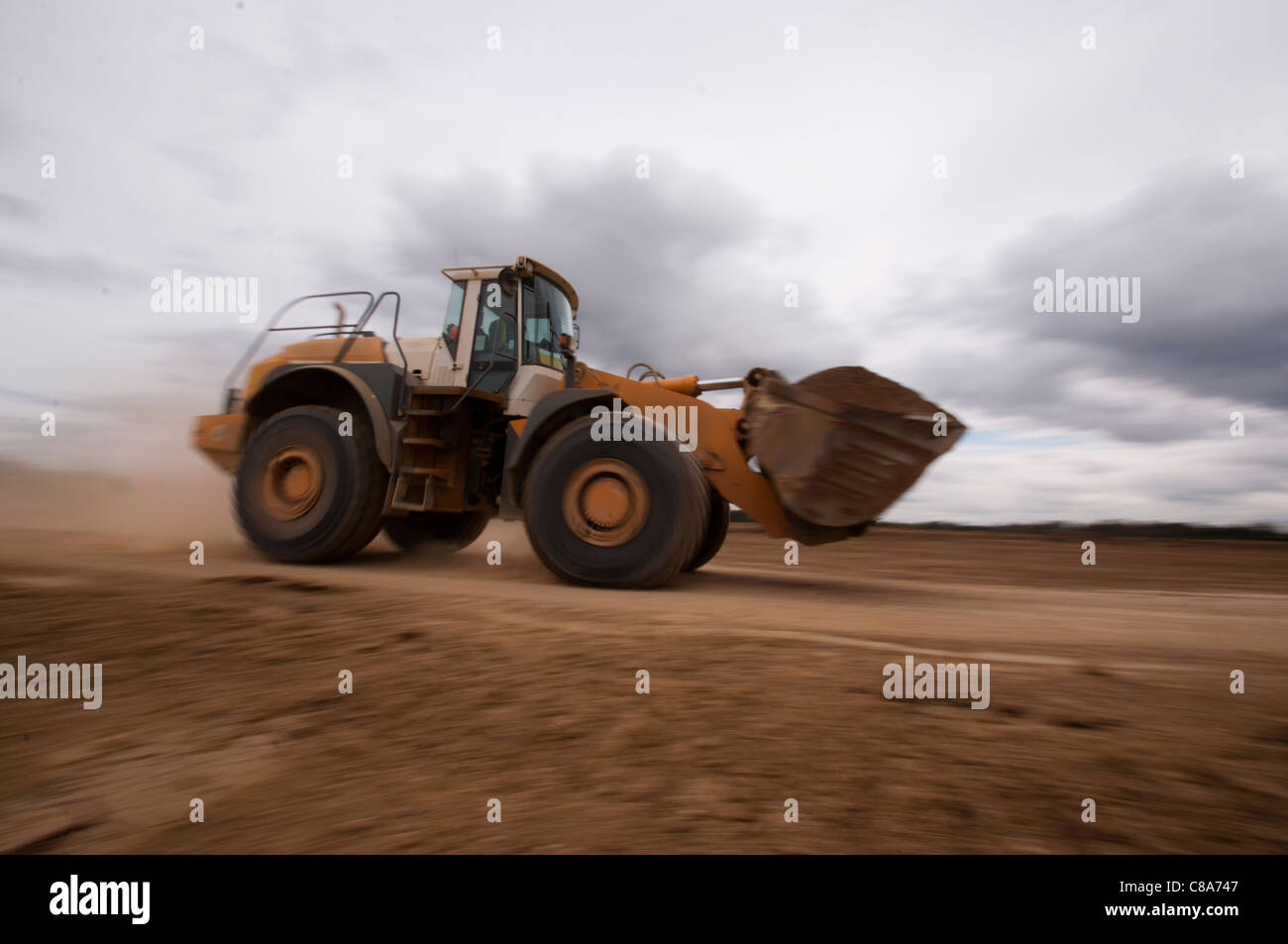 Front loading shovel working in a quarry Stock Photo - Alamy