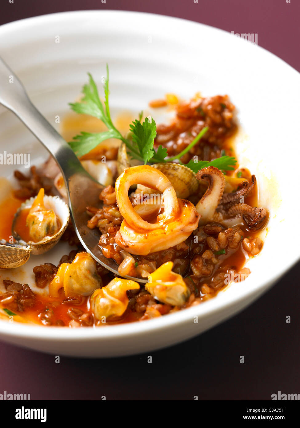 Red seafood risotto Stock Photo - Alamy