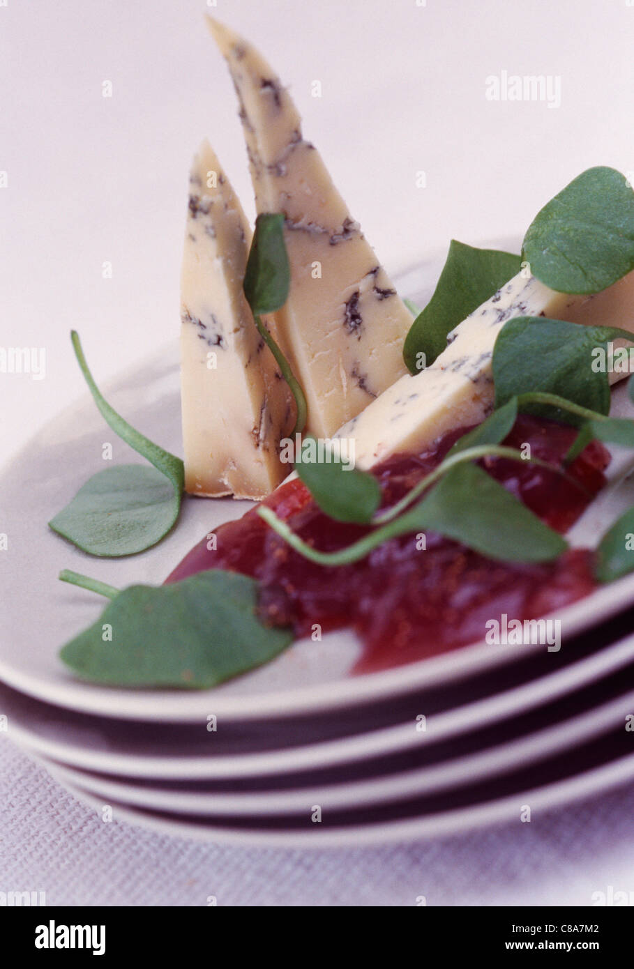 Stilton with purslane leaves and Banyuls wine jelly Stock Photo - Alamy
