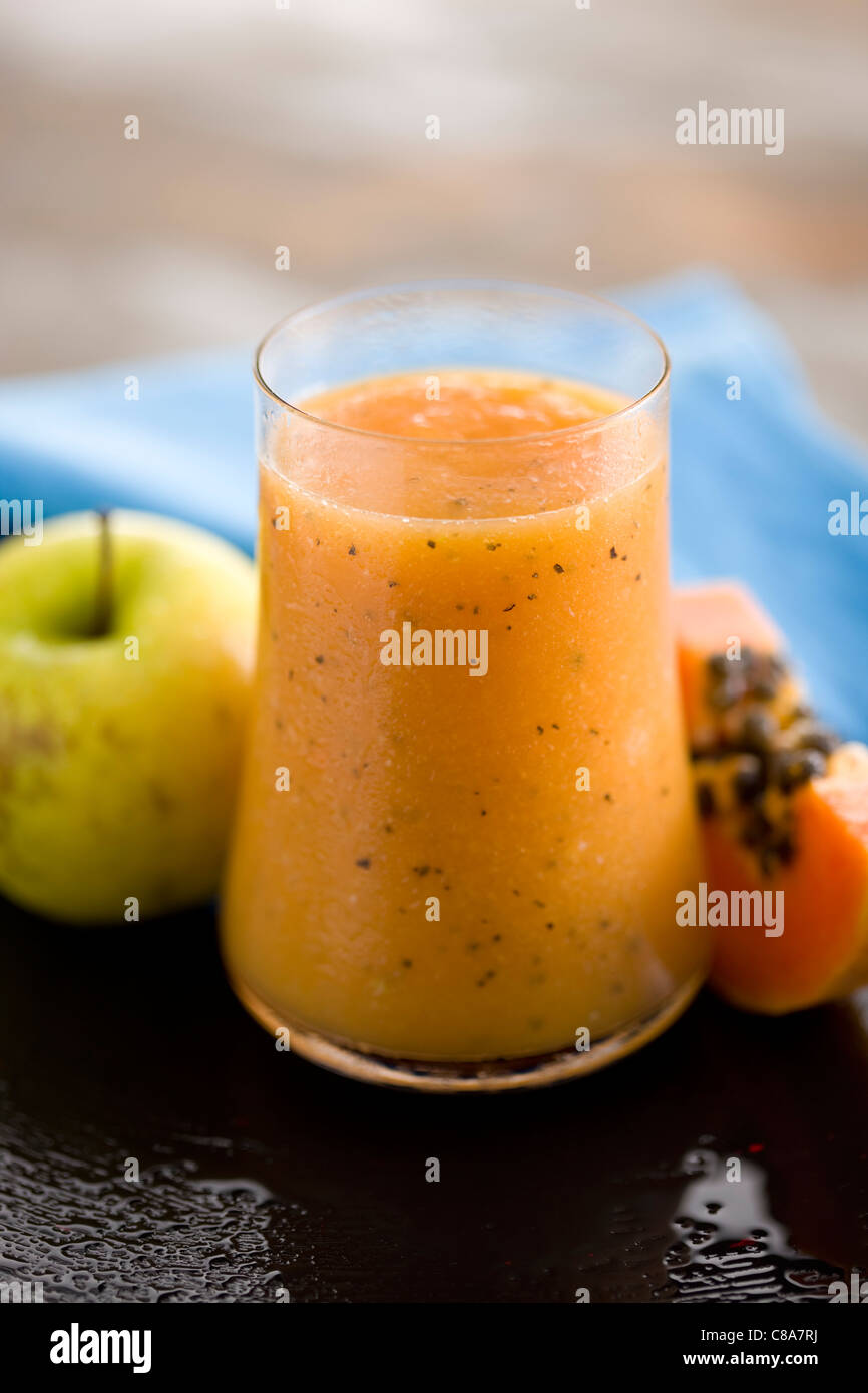 Passionfruit,papaya and apple smoothie Stock Photo - Alamy