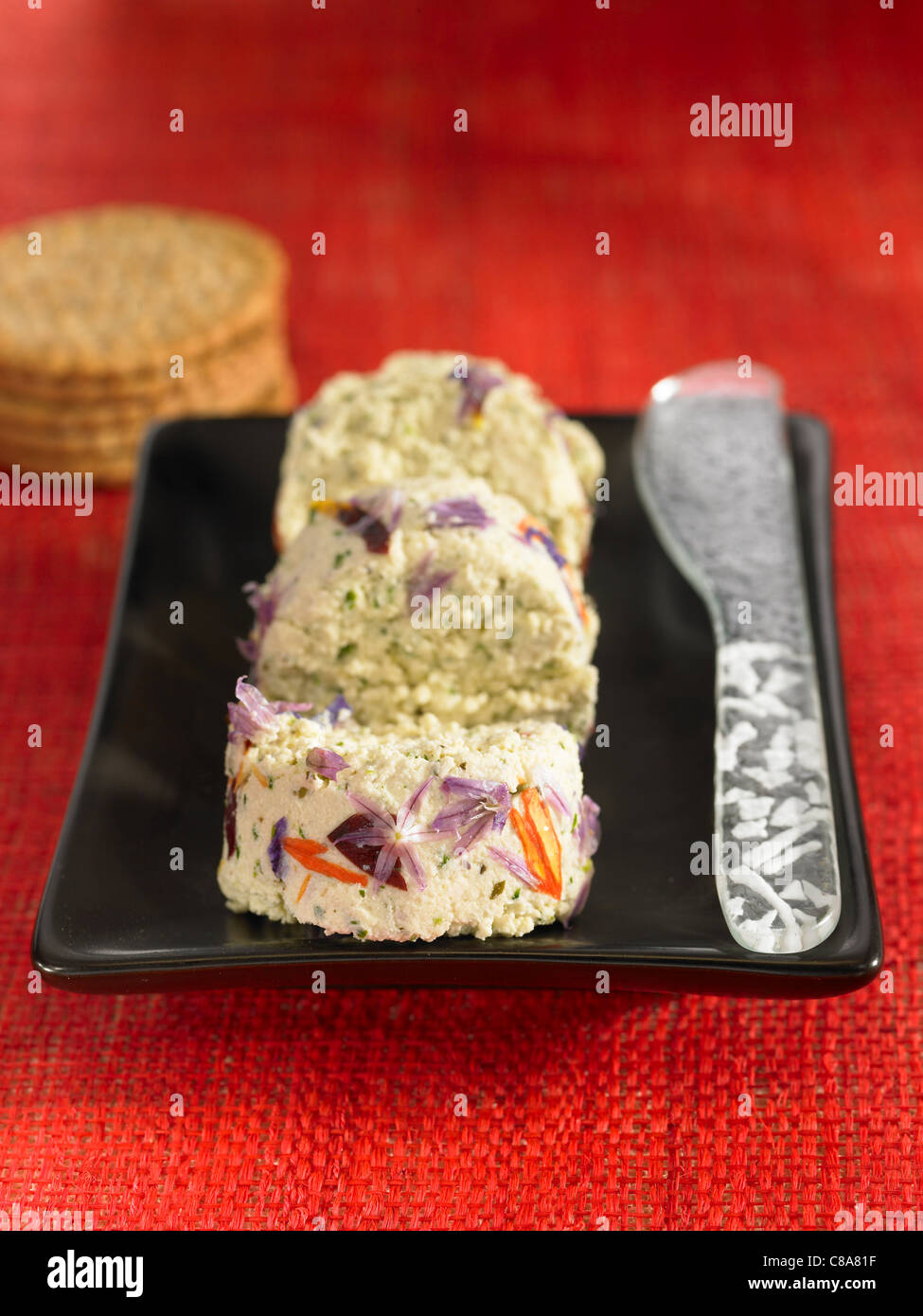 Tofu with herbs and wild flowers Stock Photo - Alamy