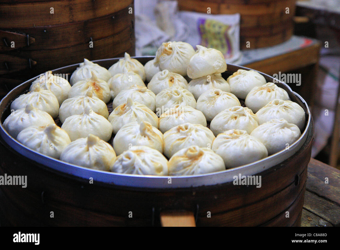 Steamed dumplings in bamboo basket, China Stock Photo - Alamy