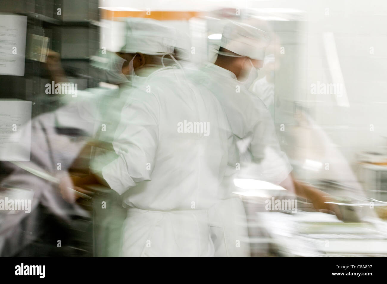 Cook working in the kitchen Stock Photo - Alamy