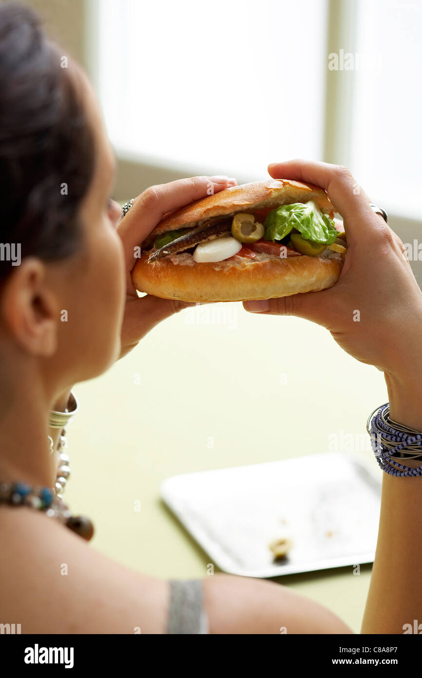 Woman eating a Pan bagna Stock Photo - Alamy