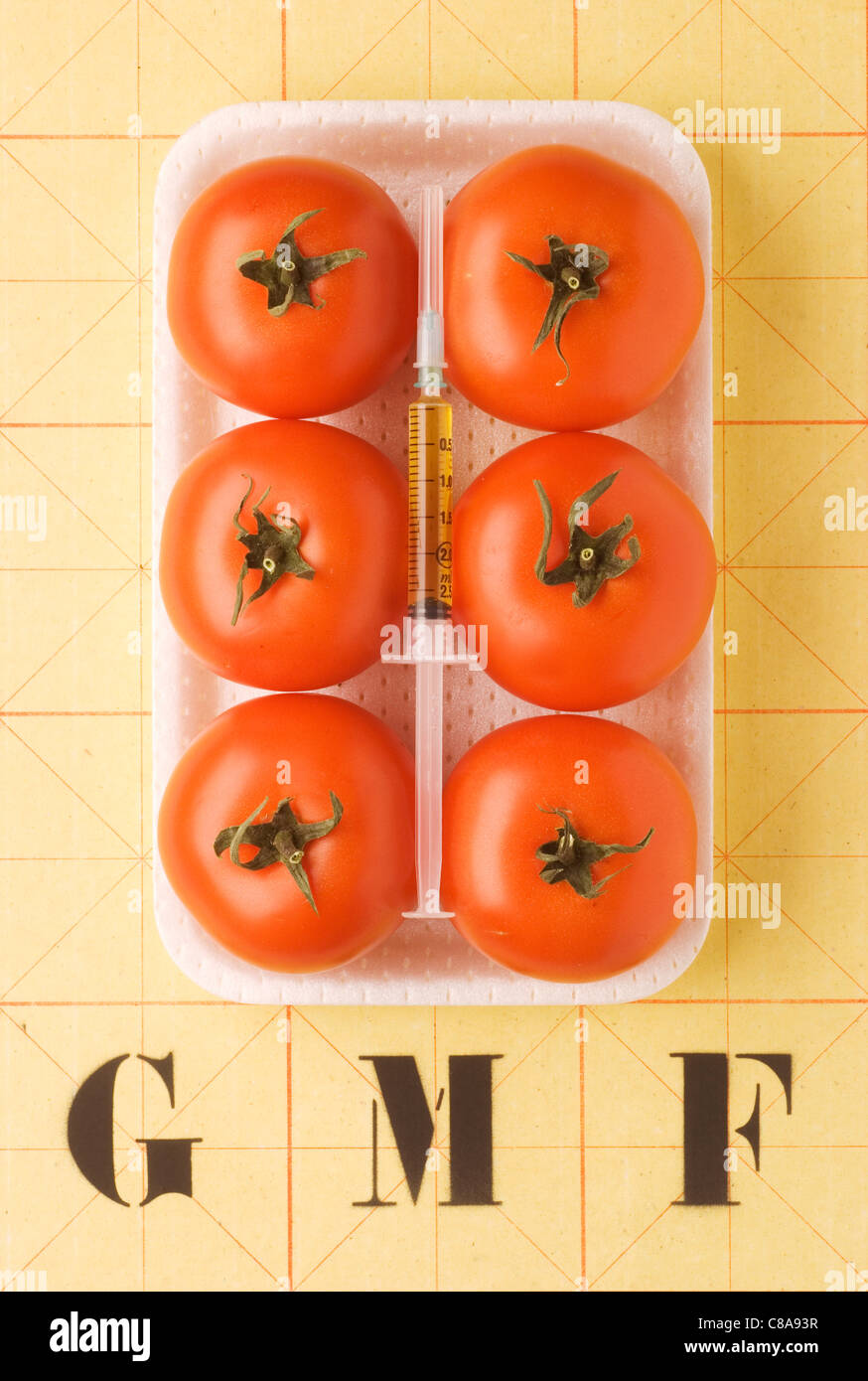 gm tomatoes with syringe Stock Photo - Alamy