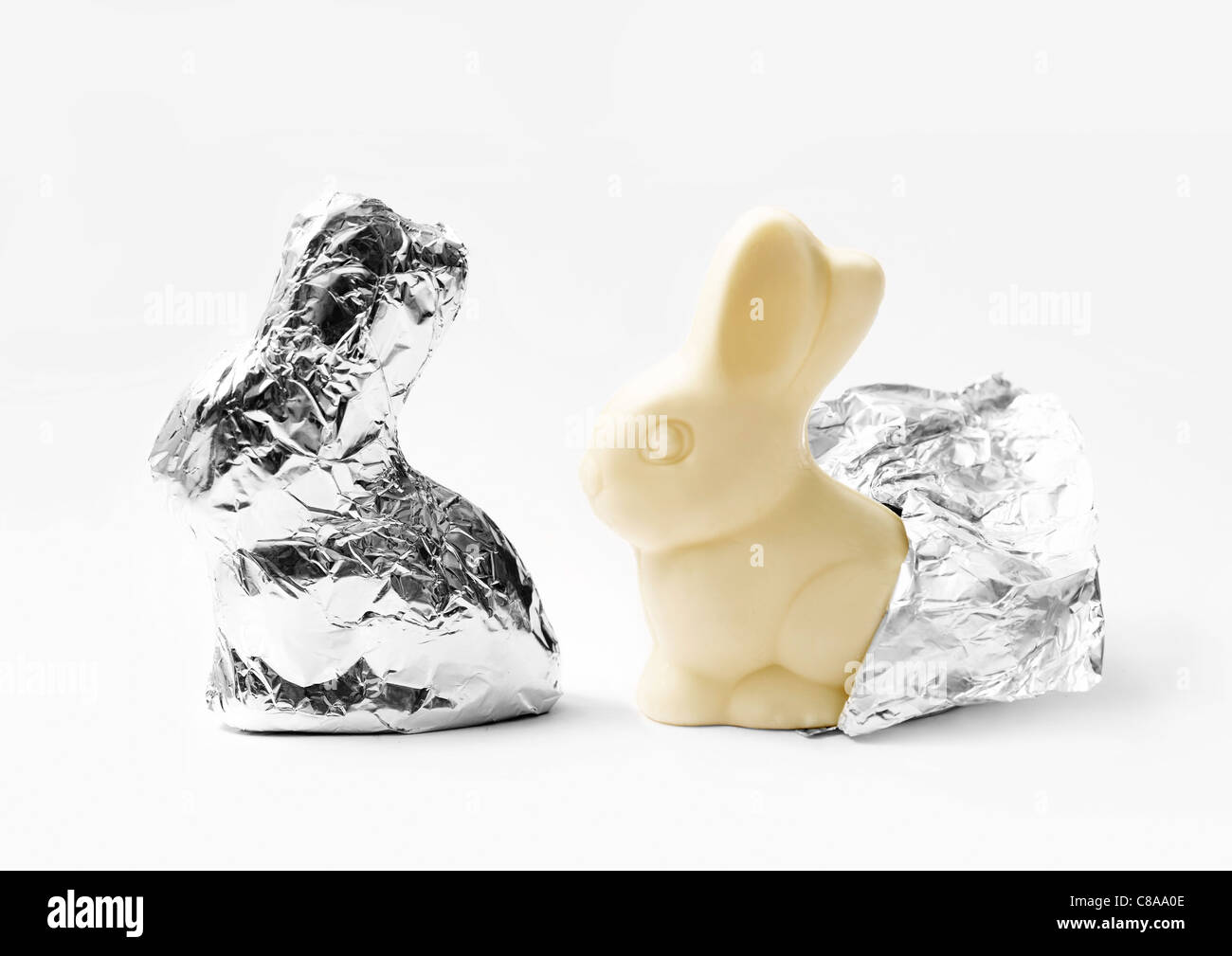 White chocolate rabbits wrapped in aluminium foil Stock Photo - Alamy