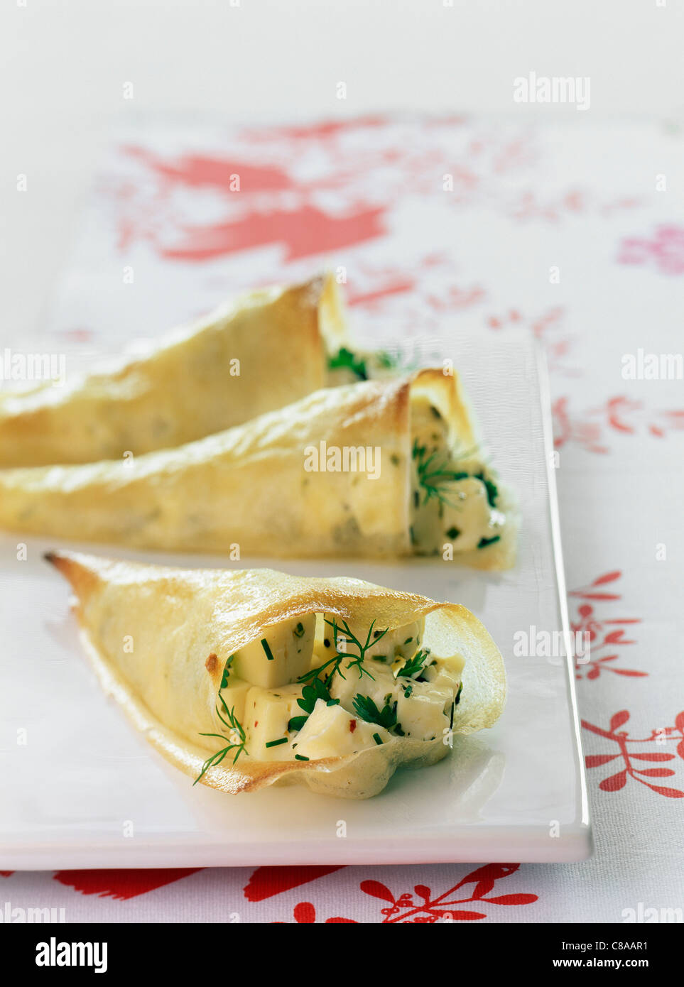 Flaky pastry cones filled with feta Stock Photo - Alamy