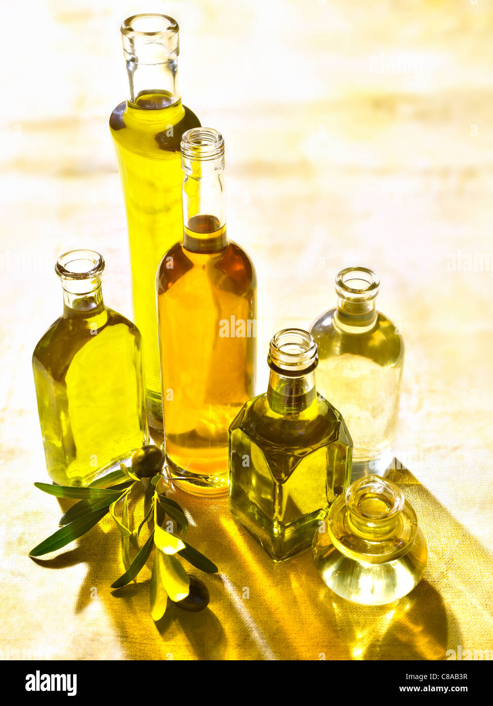 Composition with bottles of assorted oils Stock Photo - Alamy