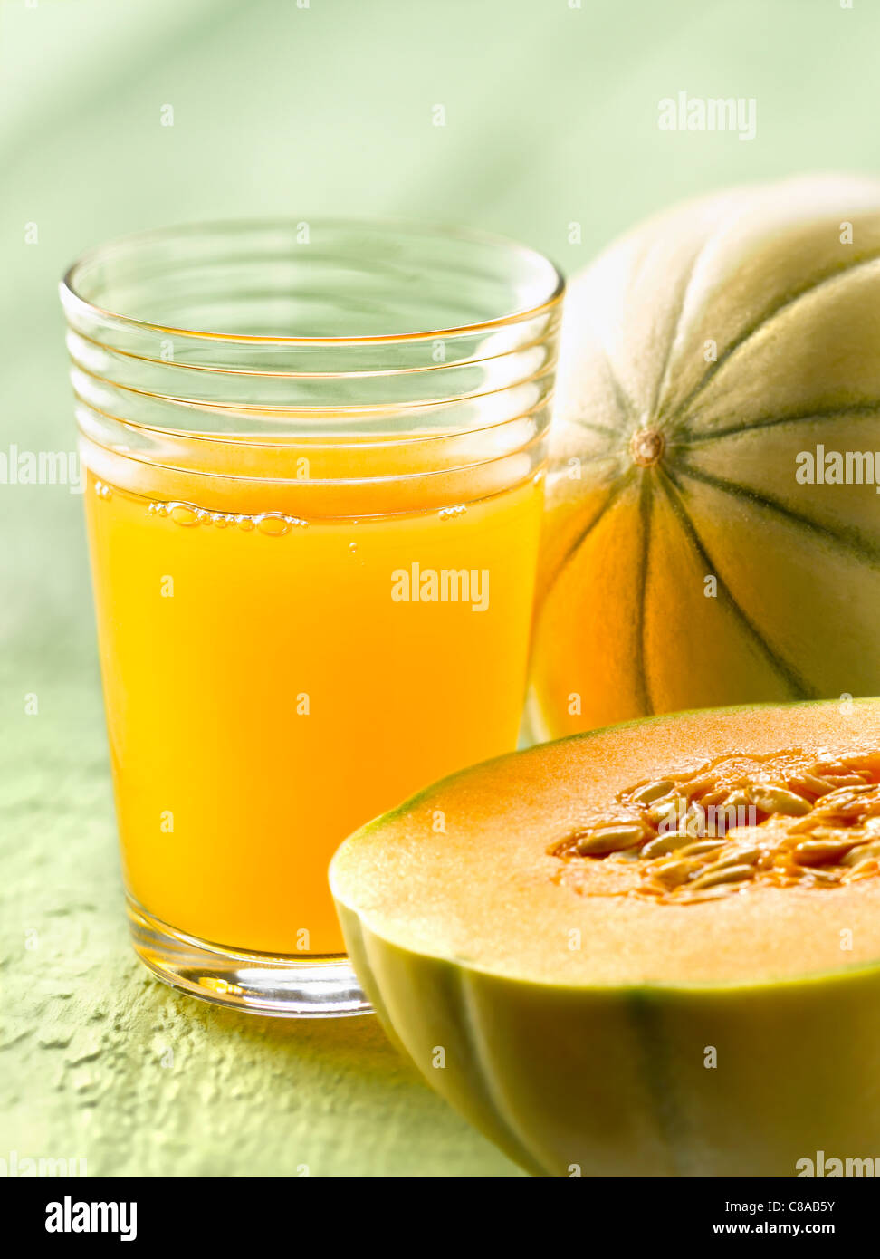 Glass of melon juice Stock Photo - Alamy