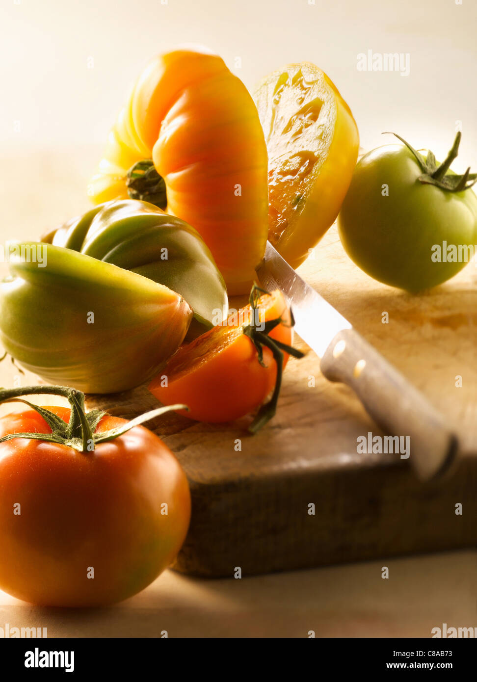 Slicing old-fashioned tomatoes Stock Photo - Alamy