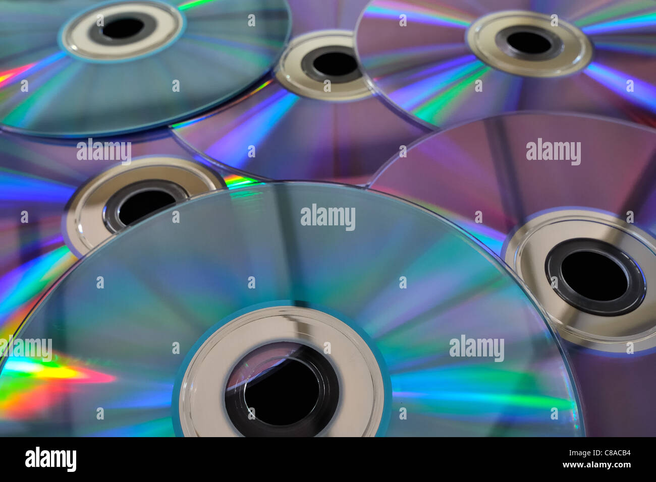 Compact disks and DVD disk reflecting coloured holograms Stock Photo ...
