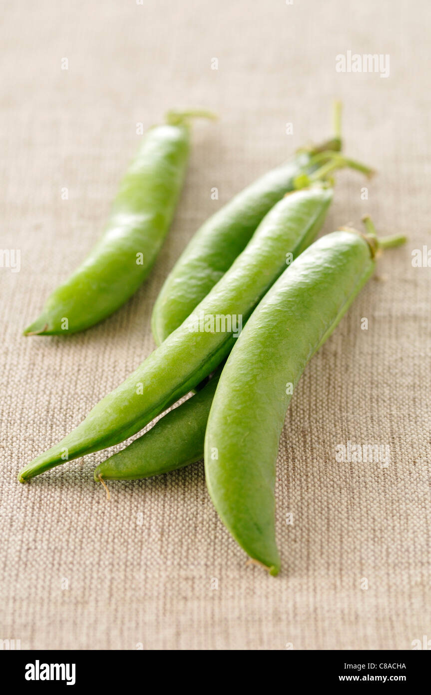 Peas with their pods Stock Photo - Alamy