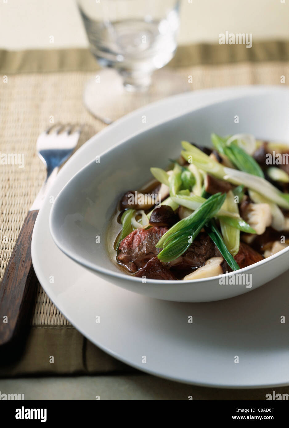 Sauteed beef with mushrooms and pak-choi Stock Photo - Alamy