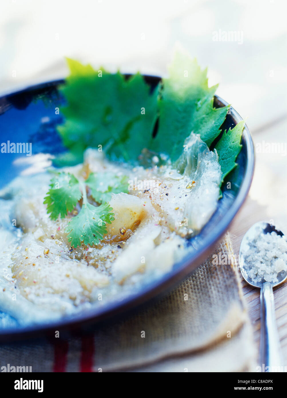 raw bass with coriander Stock Photo - Alamy