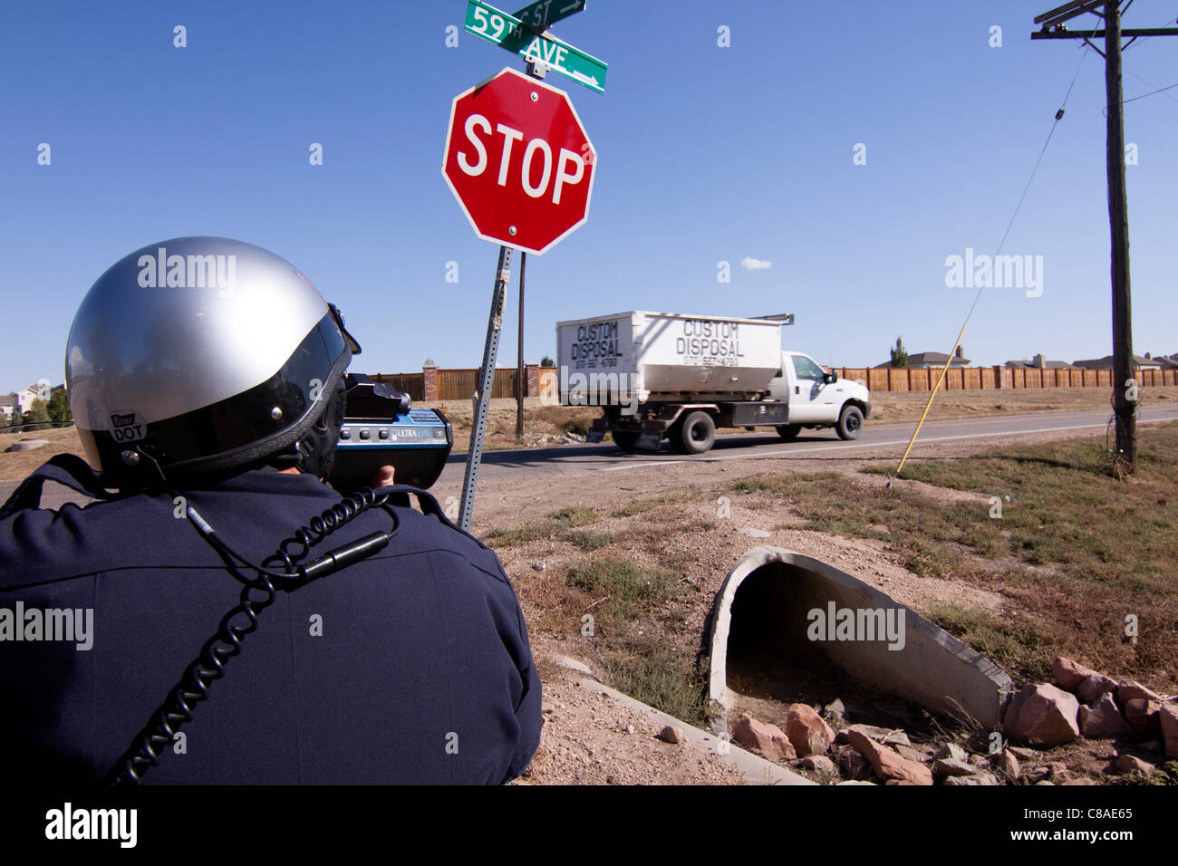 Police officers use radar to check the speed of motorists in Greely ...