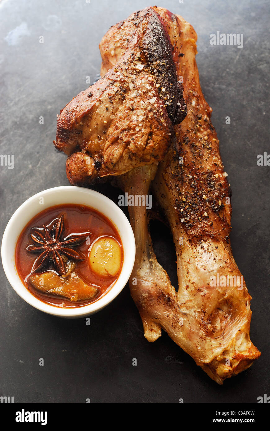 Spicy lamb knuckle joint,eggplant and confit lemon Stock Photo - Alamy