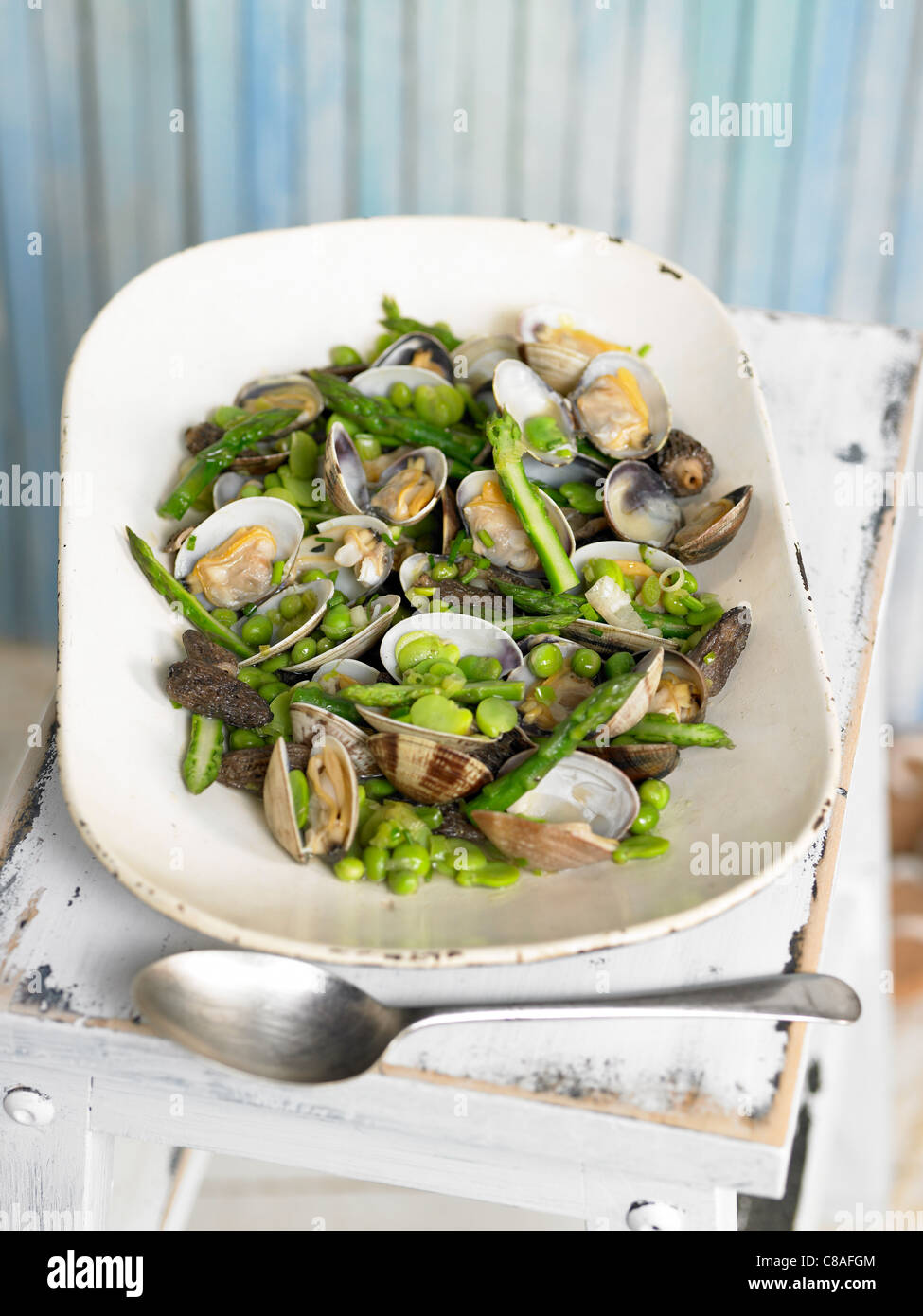Carpet-shell clam, pea and asparagus casserole Stock Photo - Alamy