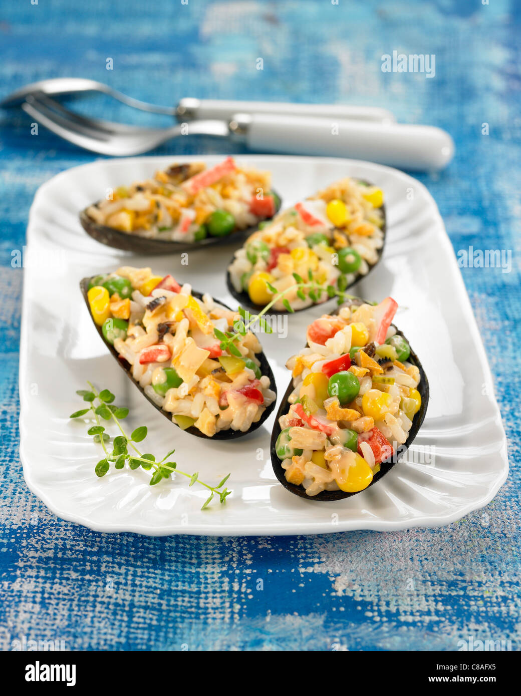 Mussels stuffed with corn and rice Stock Photo - Alamy