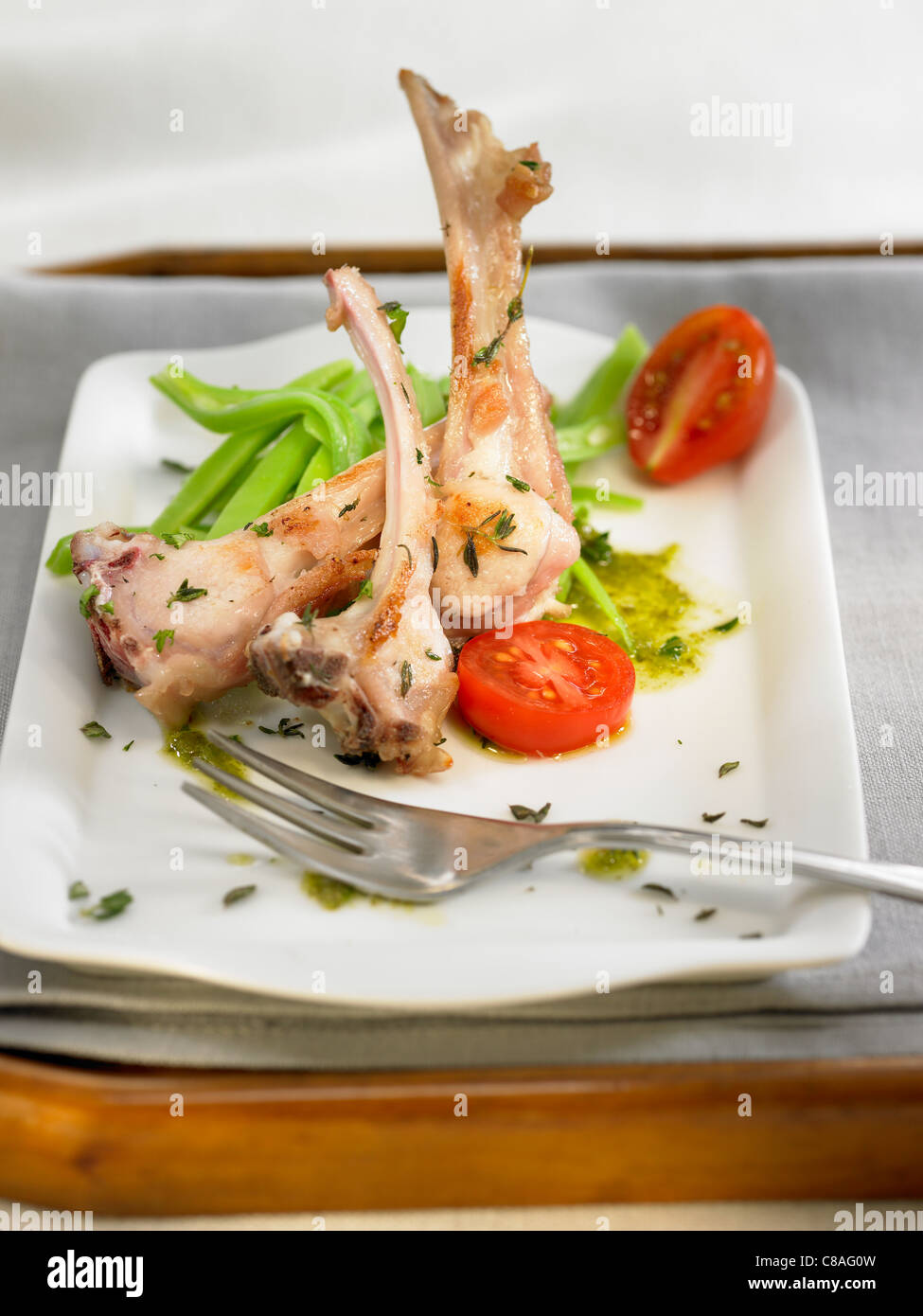 Young goat's chops with herbs Stock Photo - Alamy
