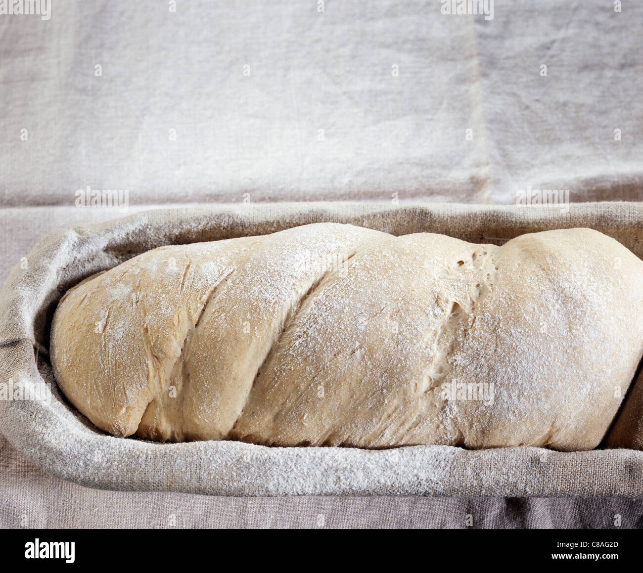 Bread rising in bread basket before baking Stock Photo - Alamy