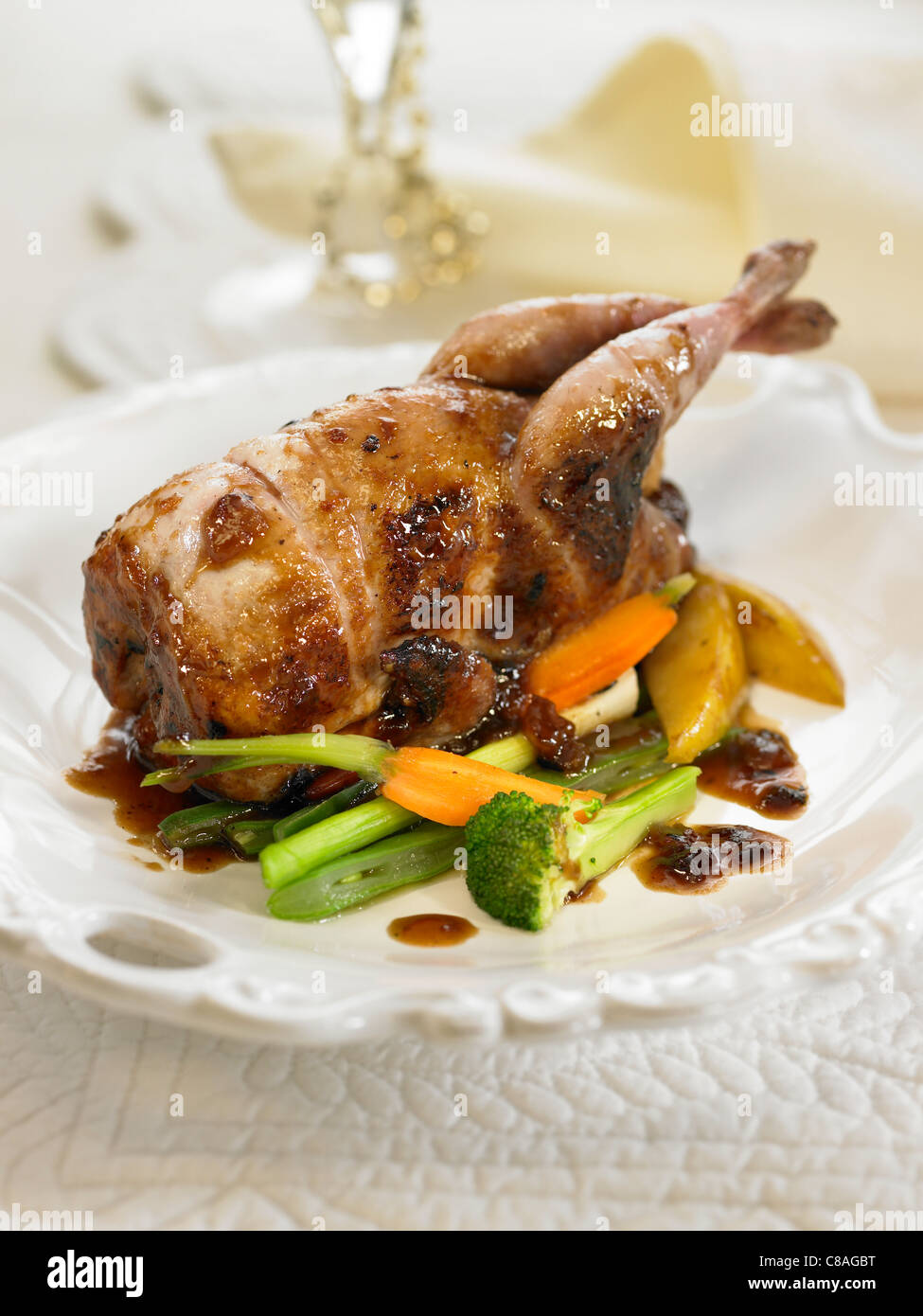 Roast partridge with plum sauce and vegetables Stock Photo - Alamy