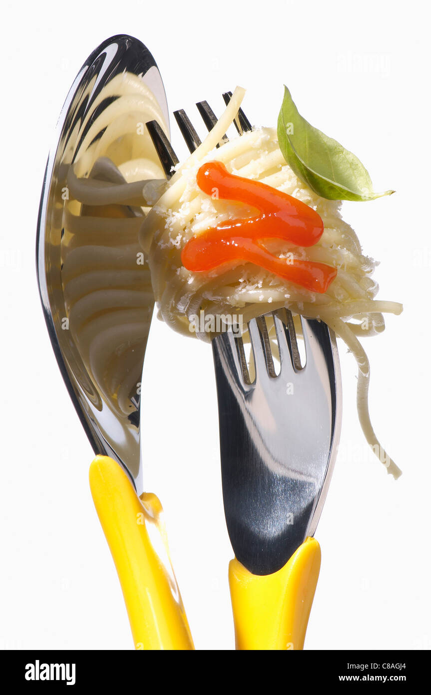 Fork with spaghetti and tomato sauce and spoon Stock Photo - Alamy