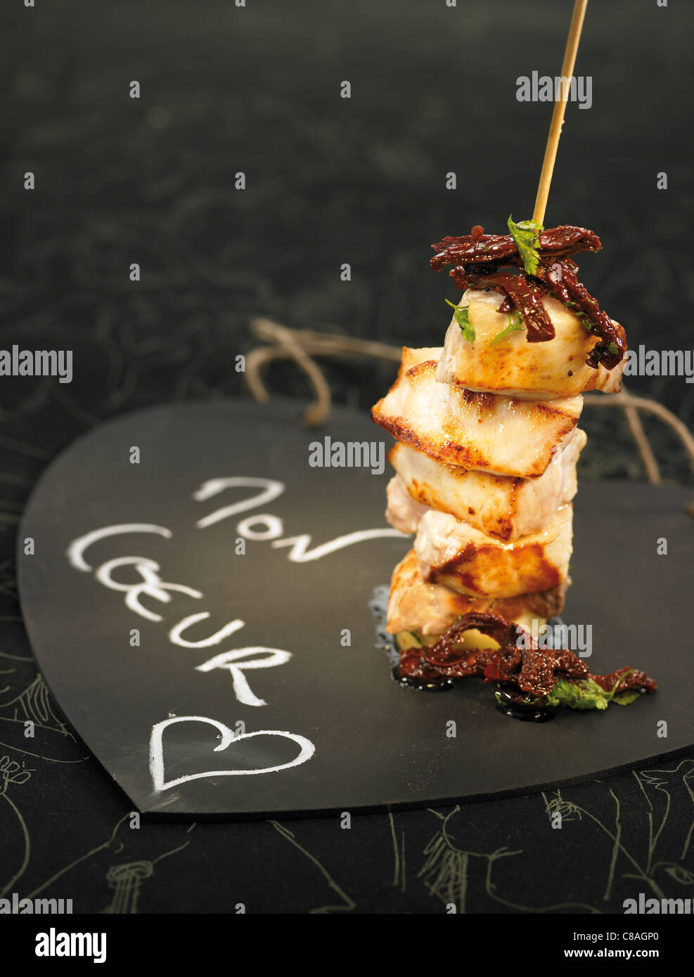 Swordfish and sun-dried tomato brochette Stock Photo - Alamy