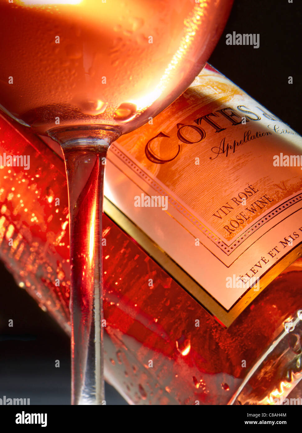 Bottle and glass of rosé wine Stock Photo - Alamy