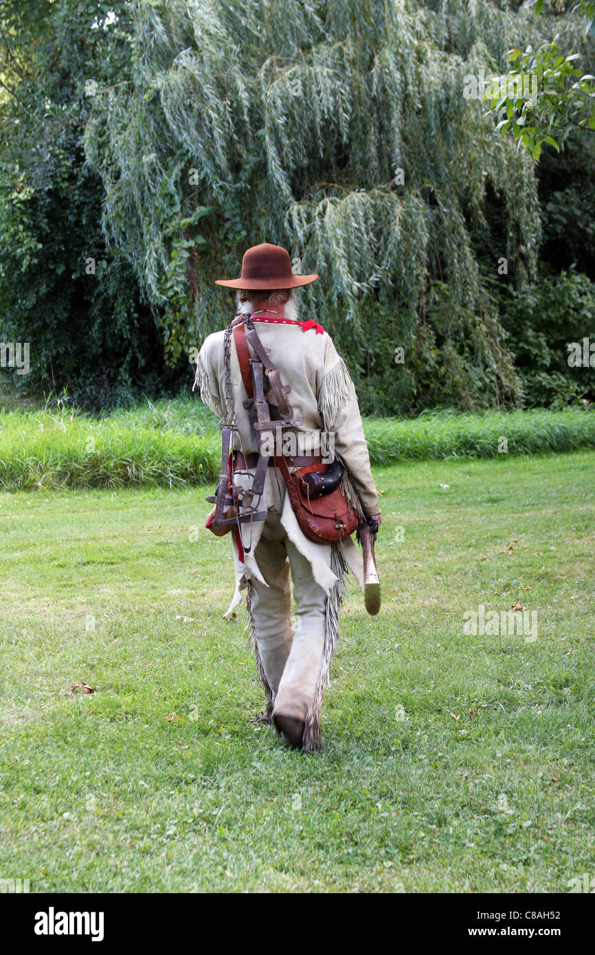 A trapper walking into the woods Stock Photo - Alamy