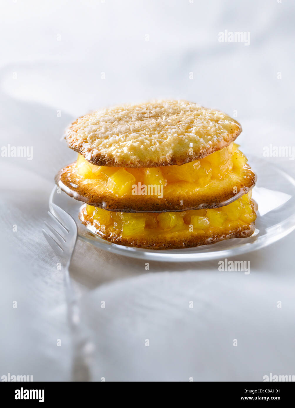 Coconut tuile biscuit,pineapple and honey Mille-feuille Stock Photo - Alamy
