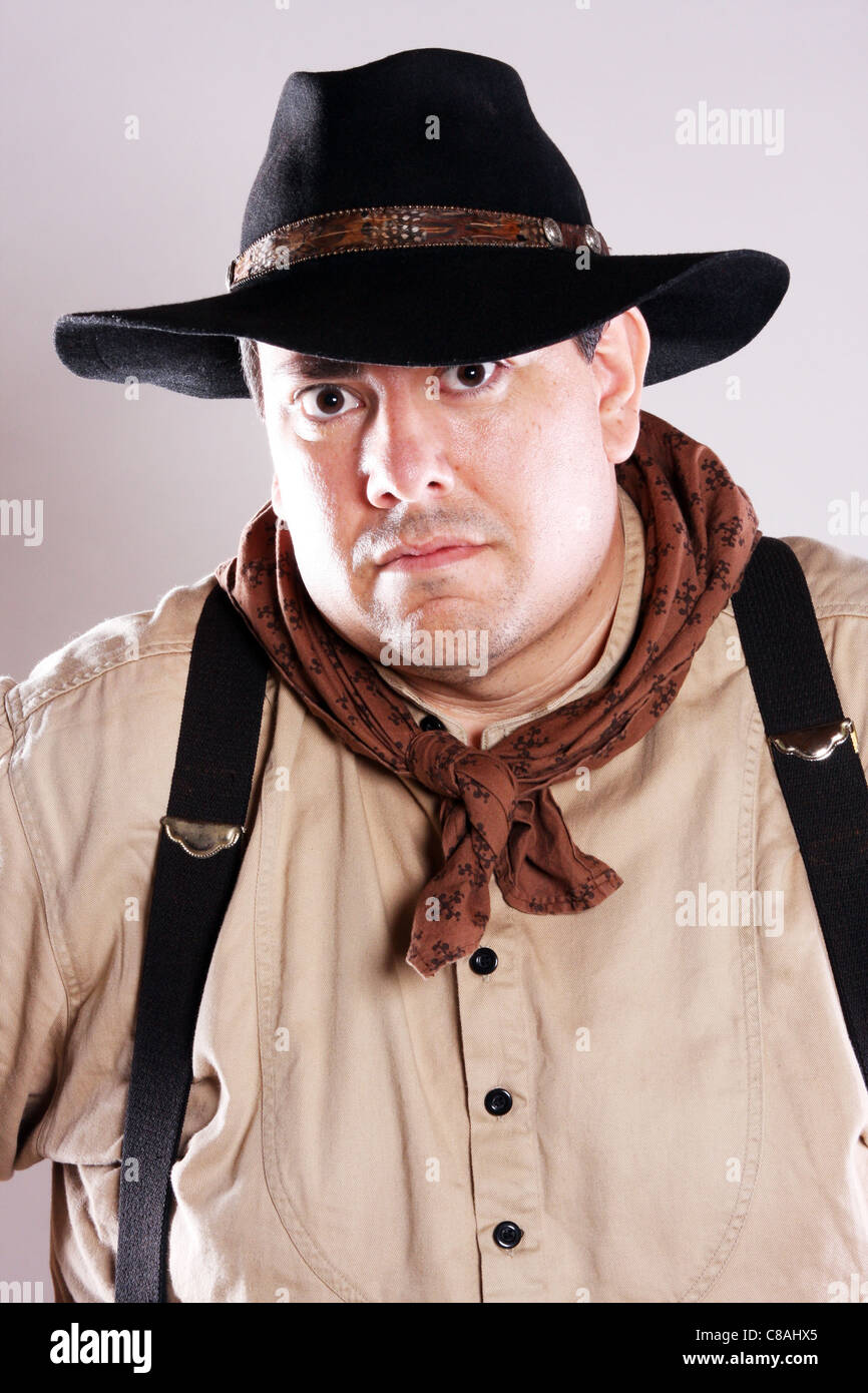 A western cowboy looking mad Stock Photo - Alamy