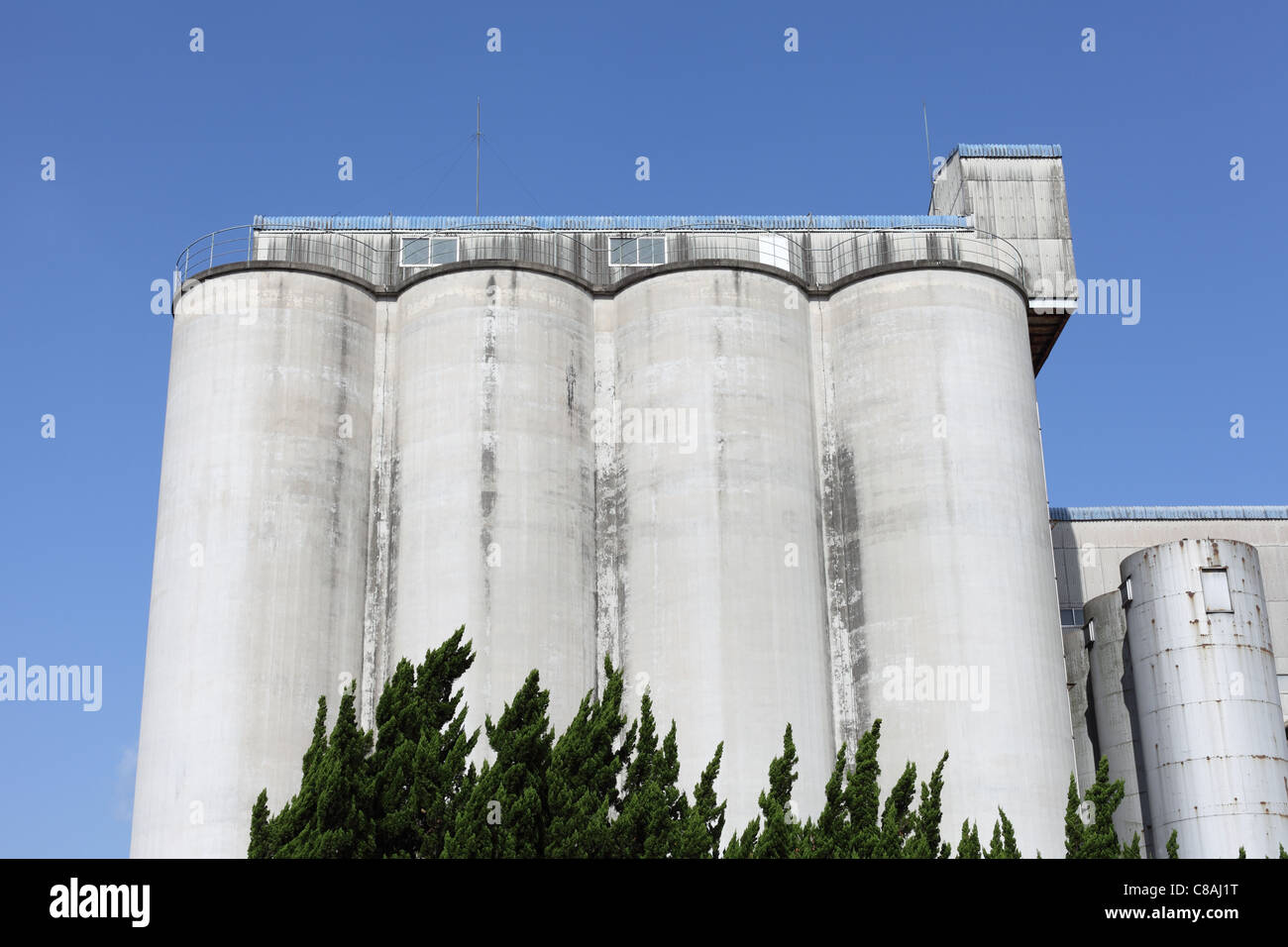 Photograph of storage silo and blue sky Stock Photo - Alamy