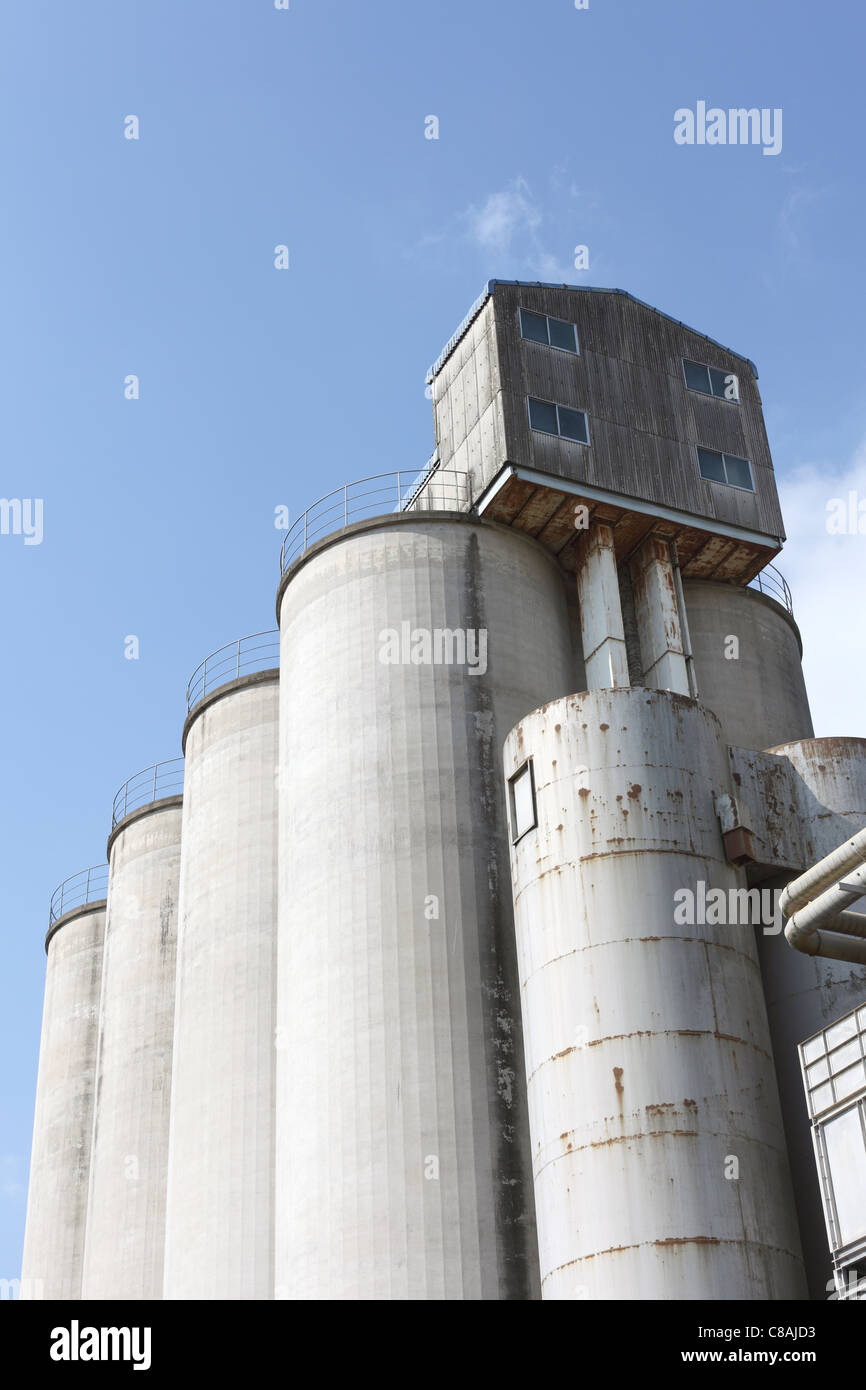 Photograph of industrial storage silo and blue sky Stock Photo - Alamy