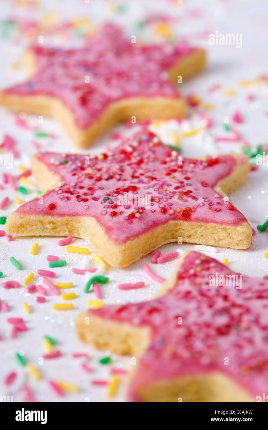 Star-shaped shortbread cookies with pink icing Stock Photo - Alamy