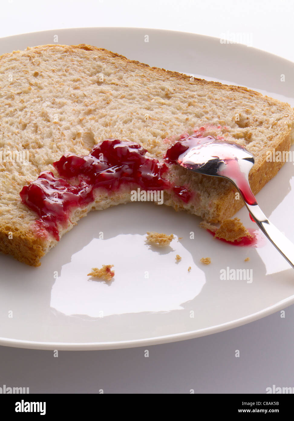 Slice of sandwich bread and jam Stock Photo - Alamy