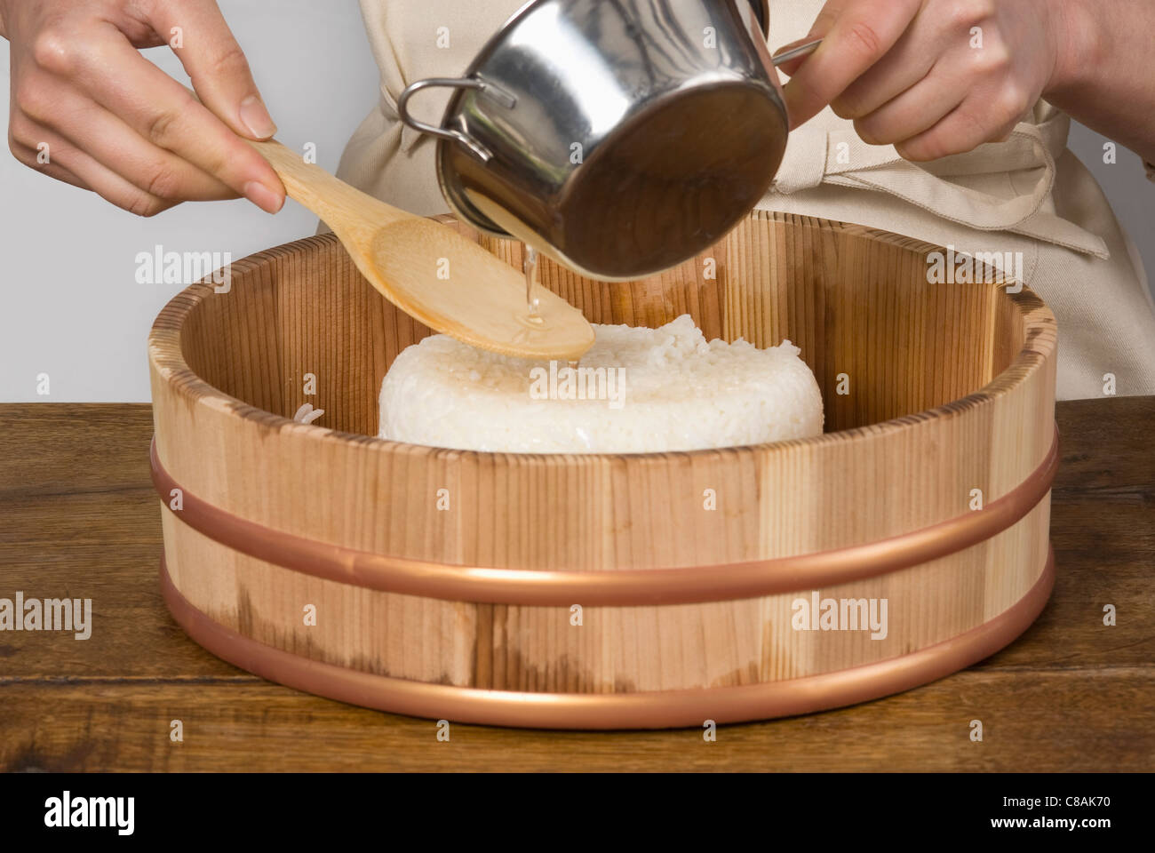Cook preparing Japanese sticky rice Stock Photo - Alamy