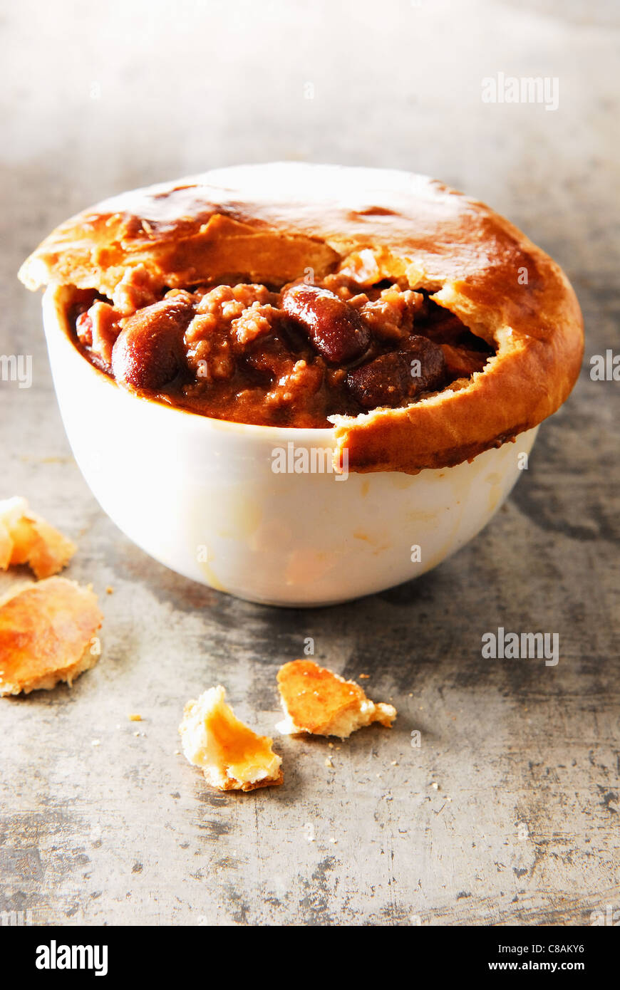 Chili con carne with pastry crust Stock Photo - Alamy