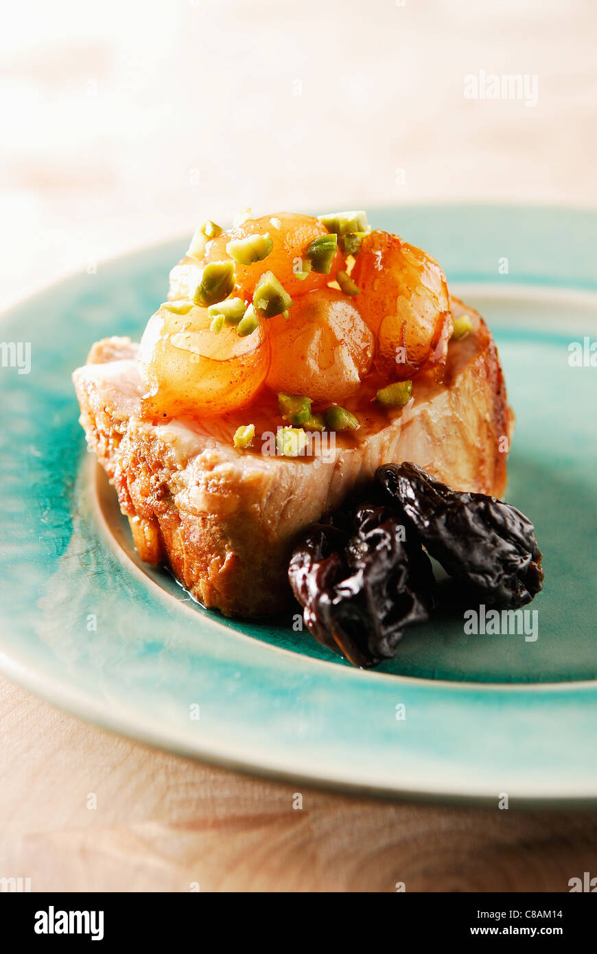 Milk-fed veal fillet with spring onions,prunes and pistachios Stock ...