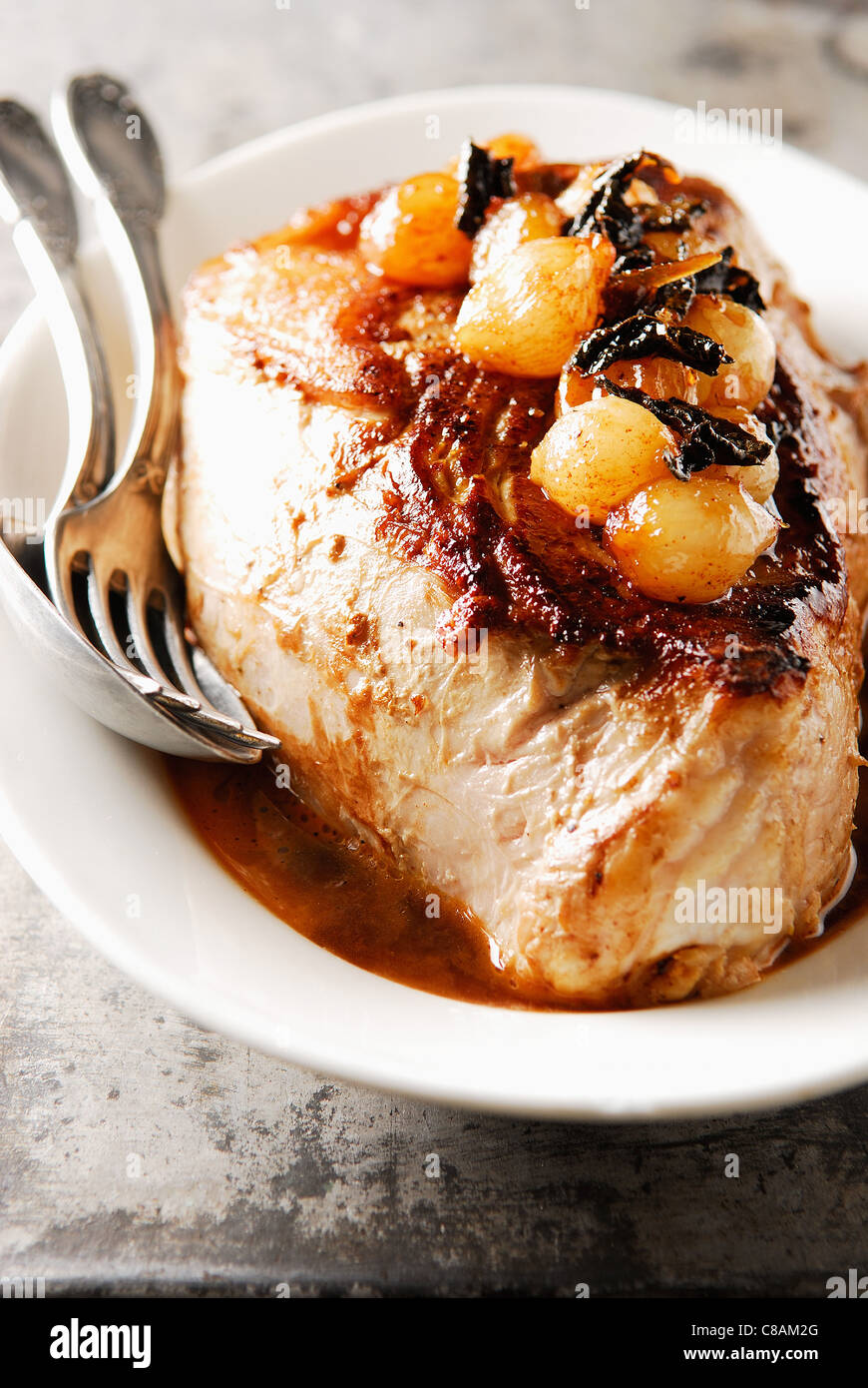 Roast veal rump with small onions and sage Stock Photo - Alamy