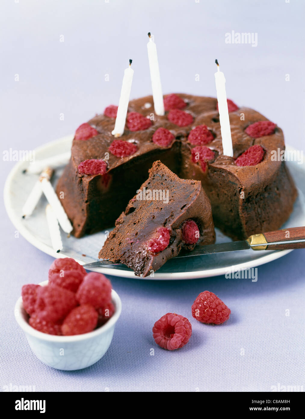 Chocolate and raspberry birthday cake Stock Photo - Alamy