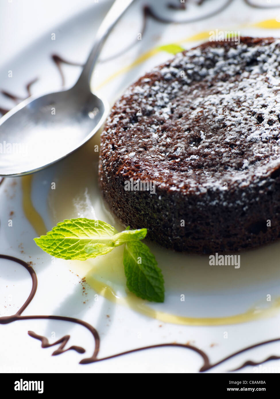 Moist chocolate cake with custard Stock Photo - Alamy