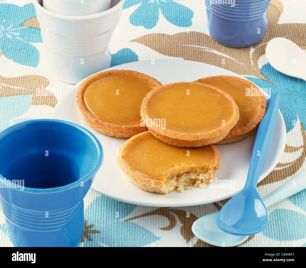 Caramel baked egg custard tartlets Stock Photo - Alamy