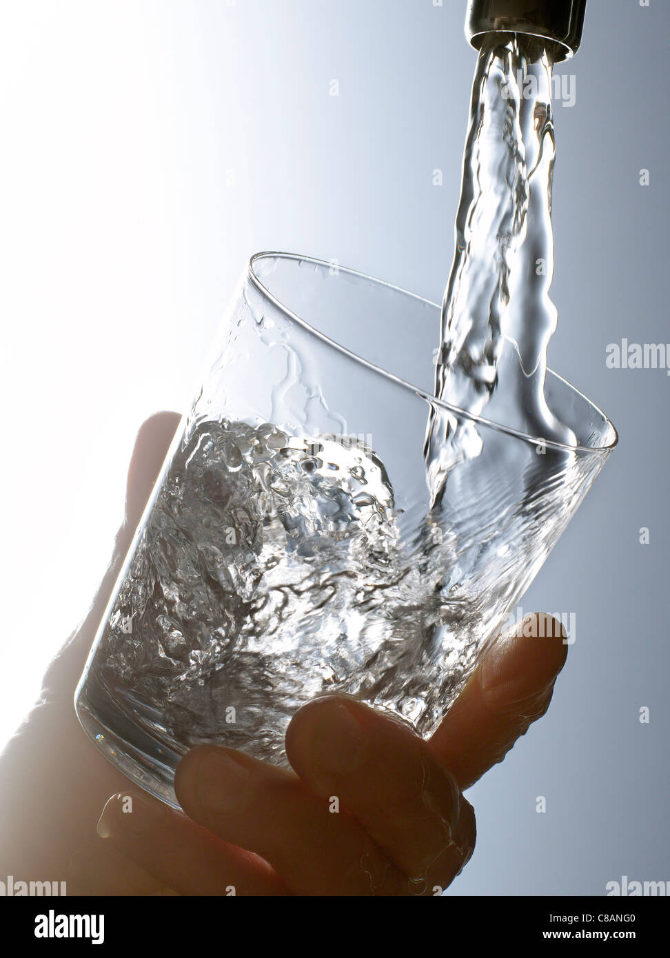 Filling a glass with tap water Stock Photo - Alamy